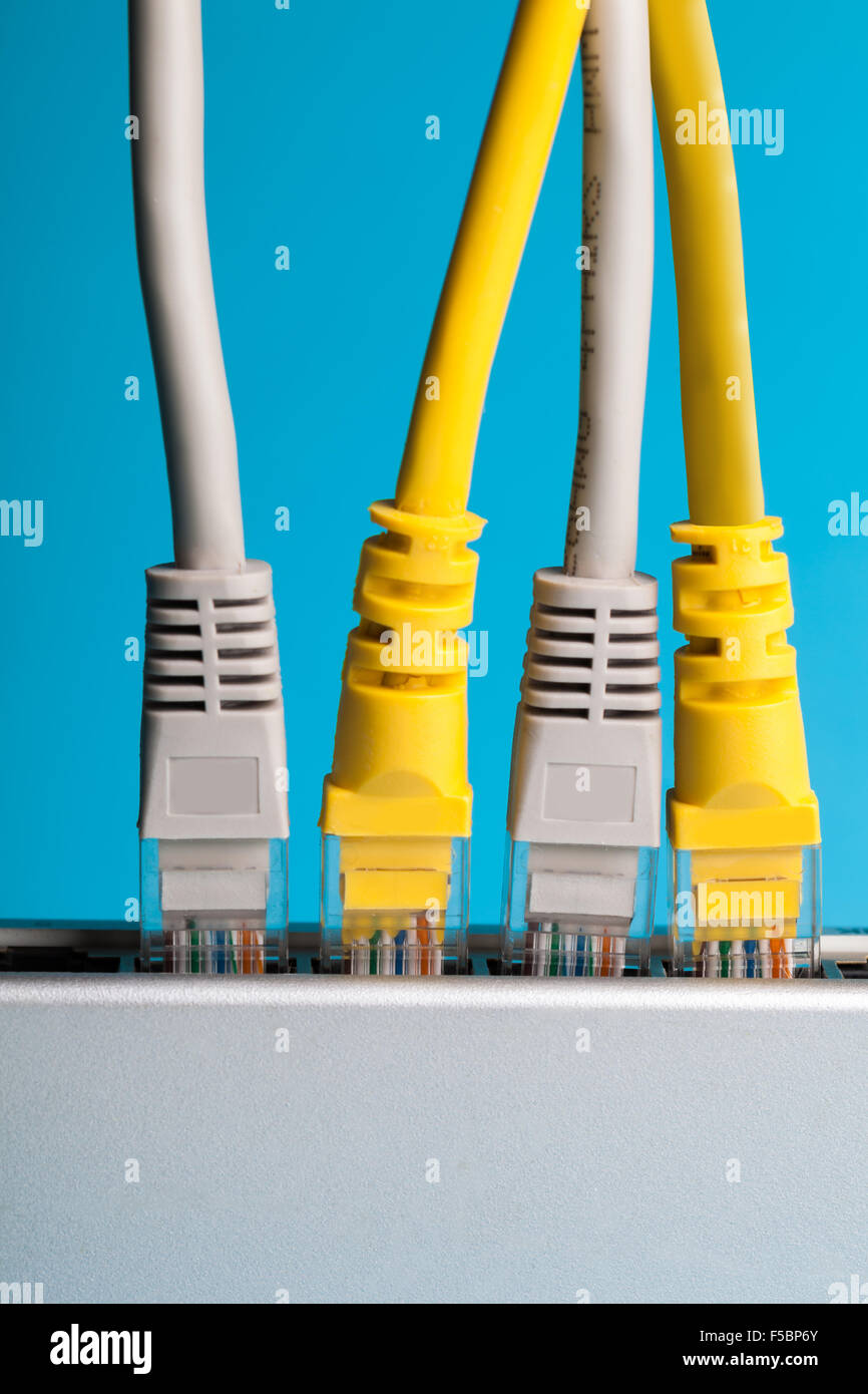 router with wires closeup on a blue background Stock Photo - Alamy