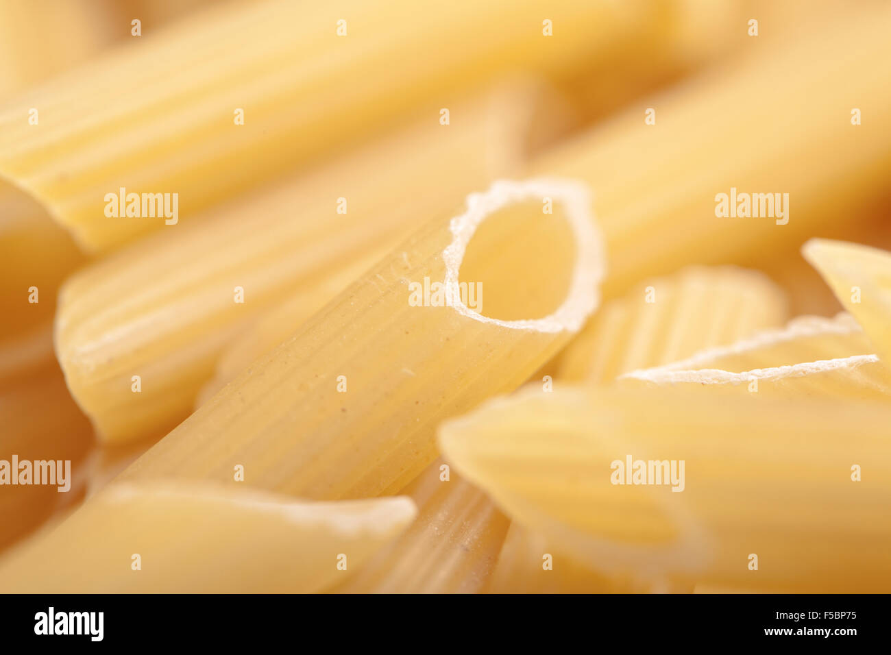 background the texture of raw pasta closeup Stock Photo - Alamy