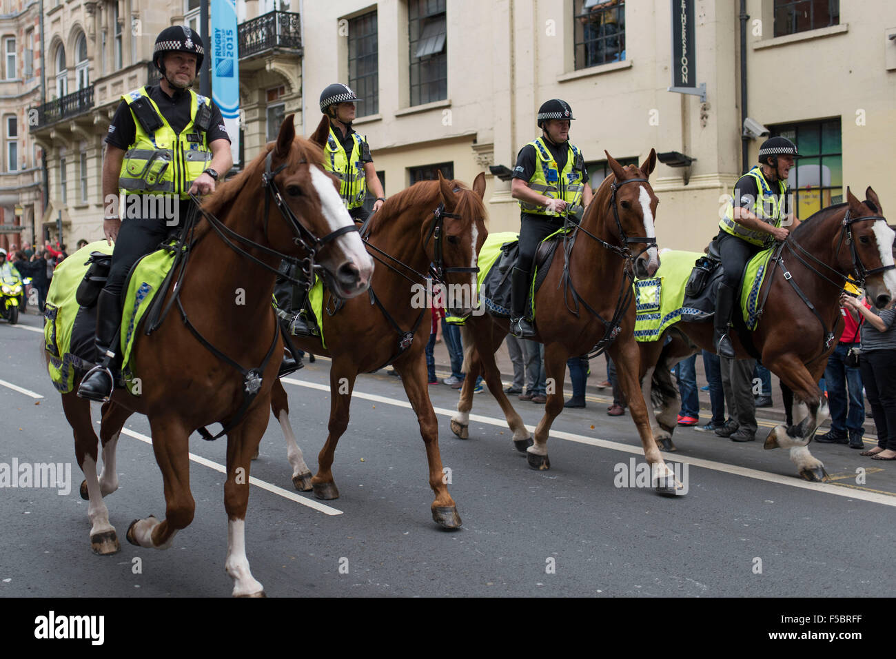 Mounted police officers riding horses during a Wales rugby game Stock ...