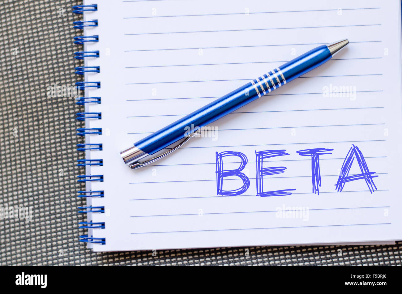 Beta text concept write on notebook Stock Photo - Alamy