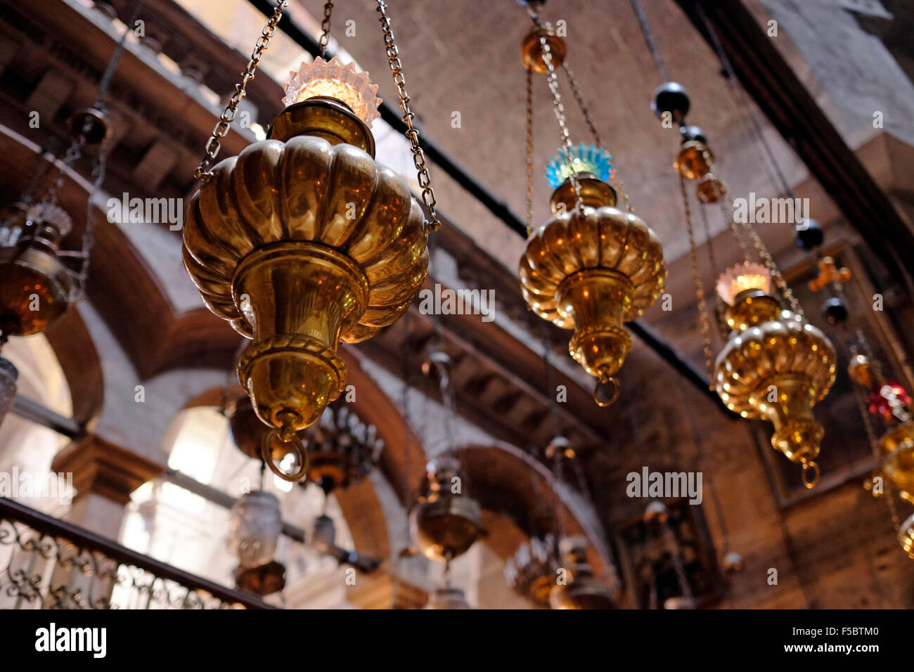 Sanctuary lamps hang at the Dome of the Rotunda of the Church of the ...
