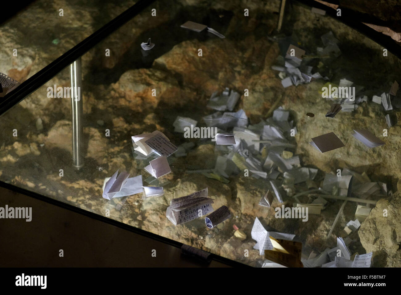 Prayer notes beneath the Rock of Calvary or Chapel of Adam in the Holy ...