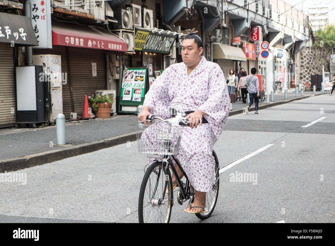 sumo on a bike Stock Photo - Alamy