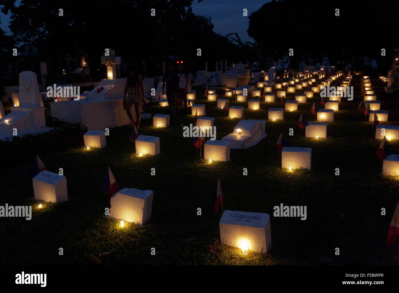 Nov. 1, 2015 - Manila, Philippines - Visitors walk along the rows of ...