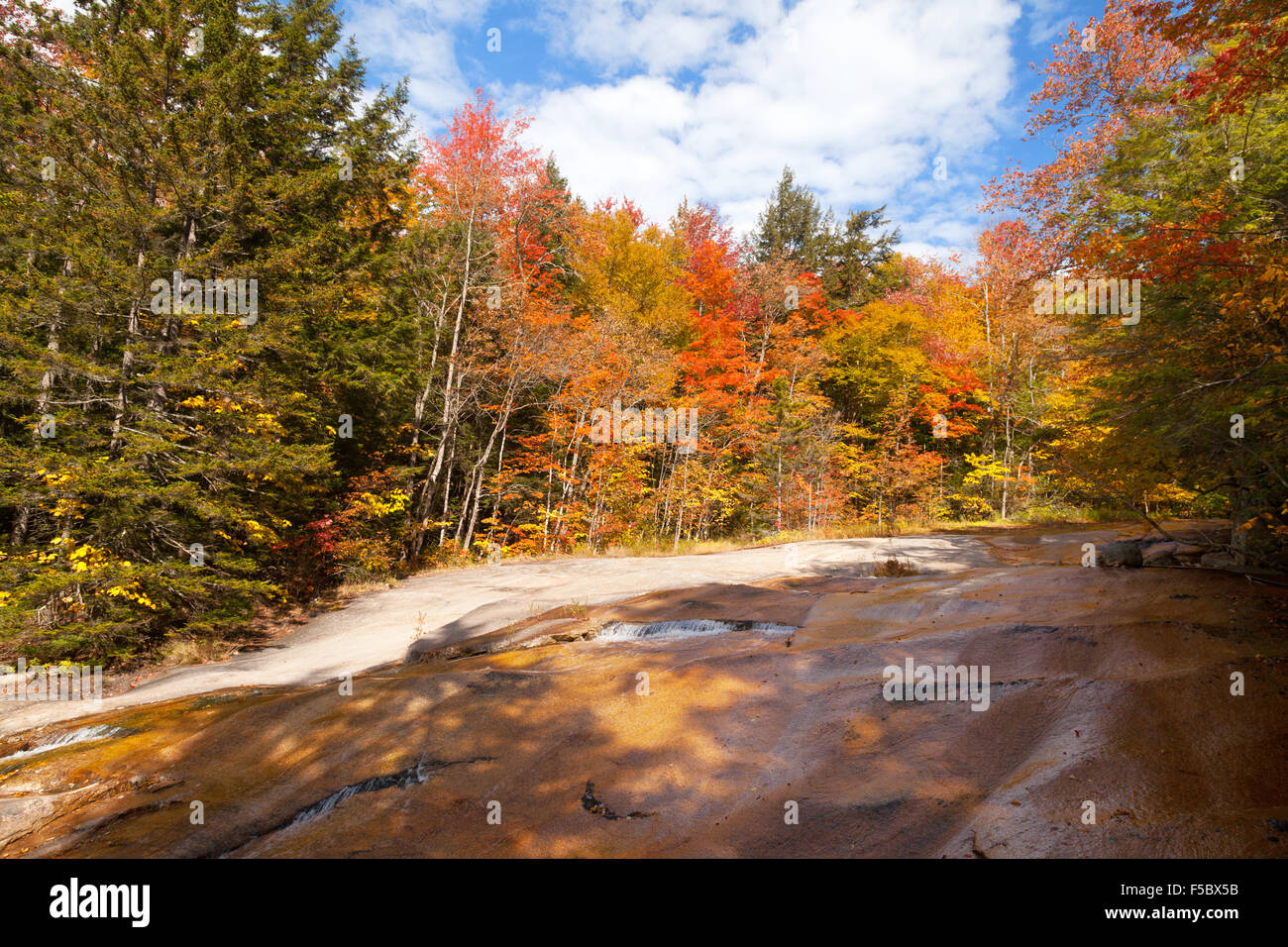 Water flowing over Table Rock, the flume, Franconia Notch State Park ...