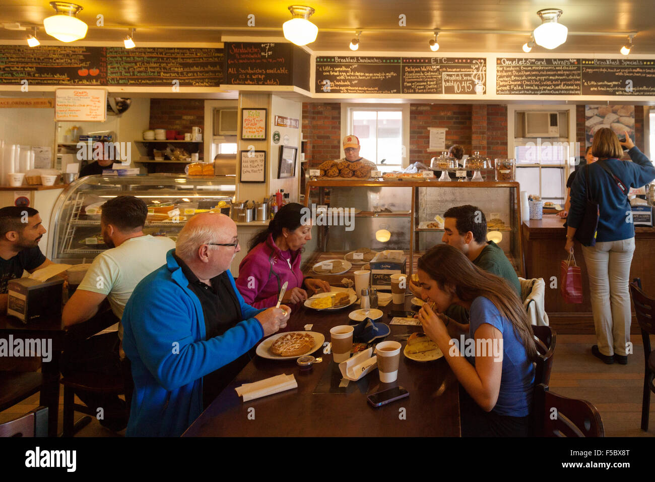People sitting inside The Cafe on Main, Main Street, Stowe, Vermont USA ...