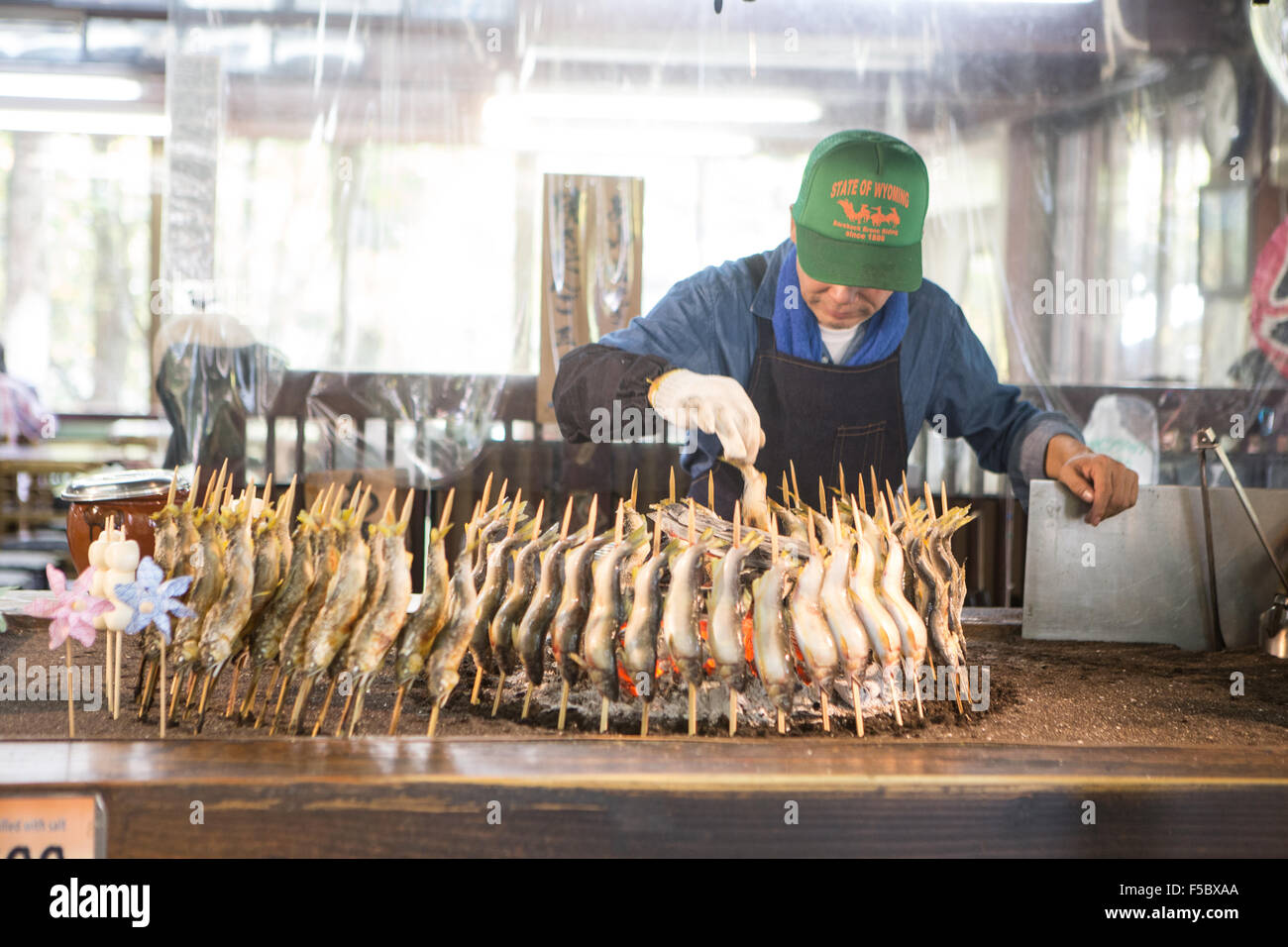 Man cooking on bbq hi-res stock photography and images - Alamy