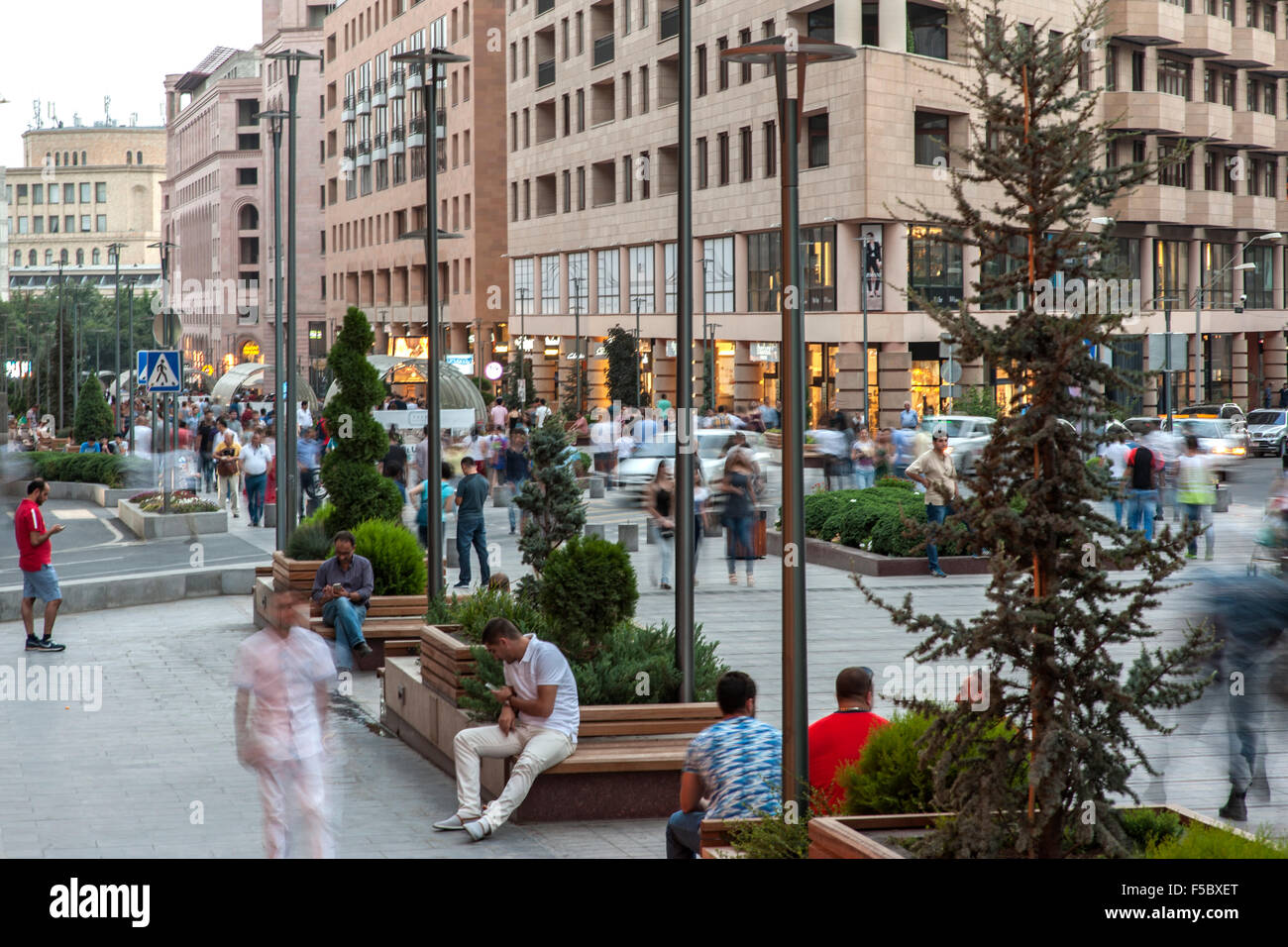 Pedestrians walking along Northern Avenue, a pedestrian street in ...