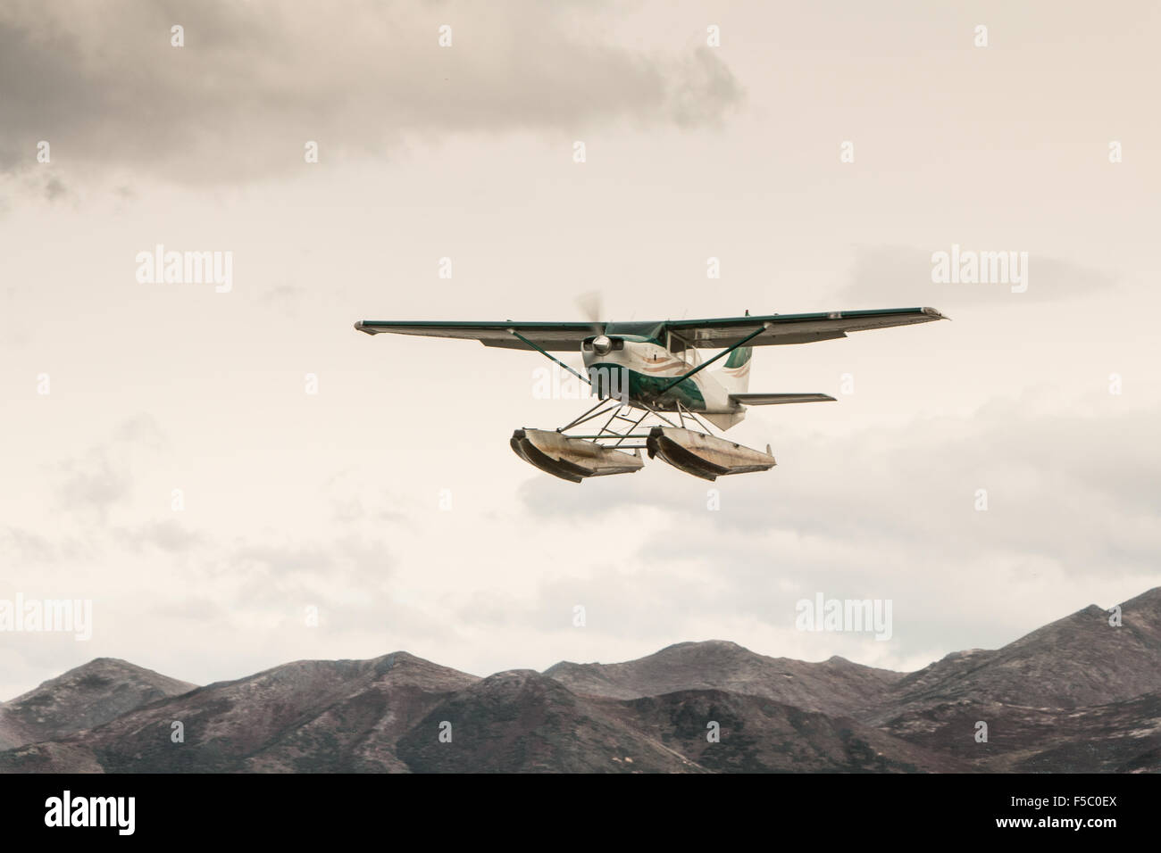 Sea plane over mountains in Anchorage, alaska Stock Photo - Alamy