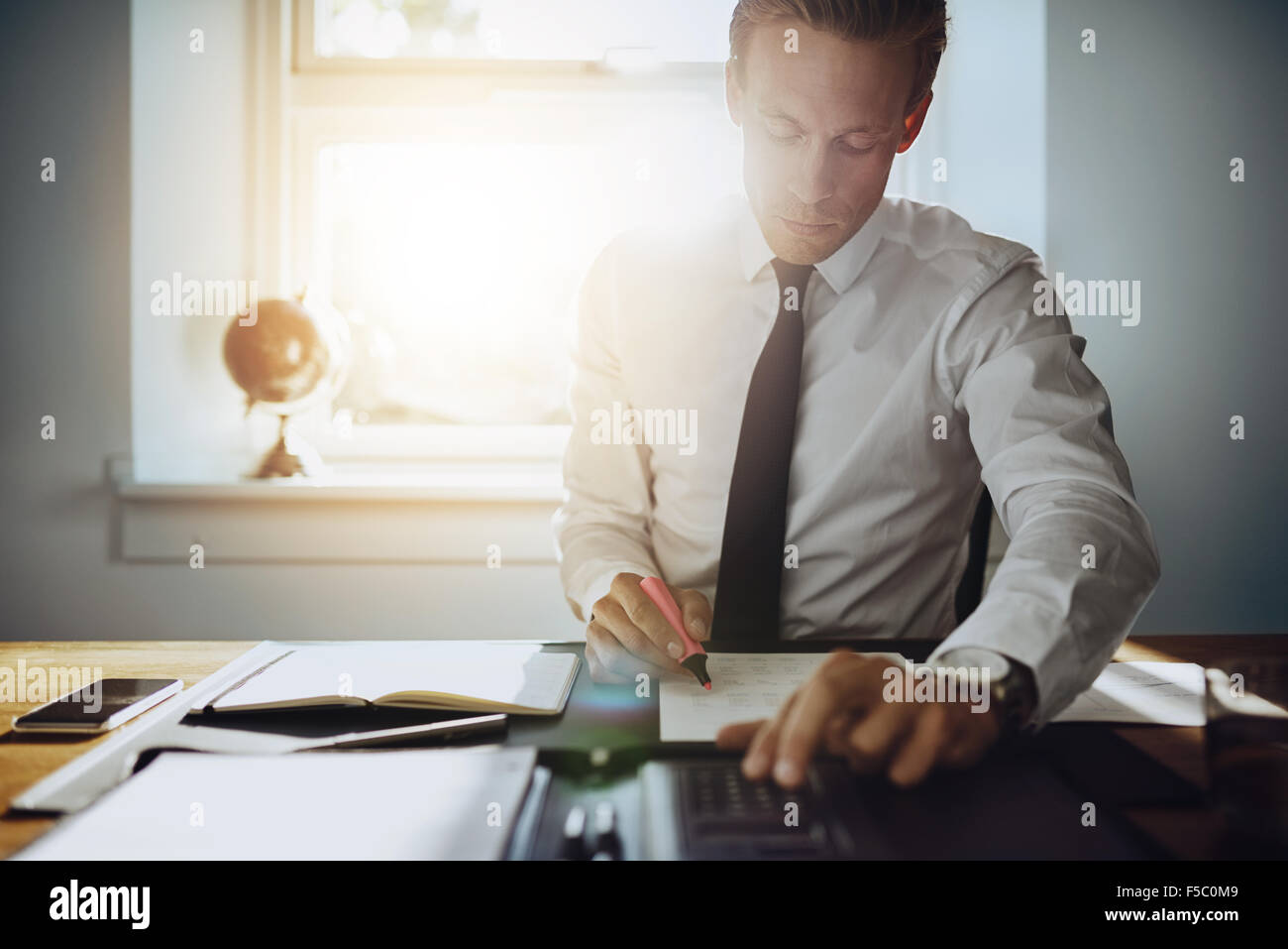 Executive business man working on accounts while being concentrated and ...