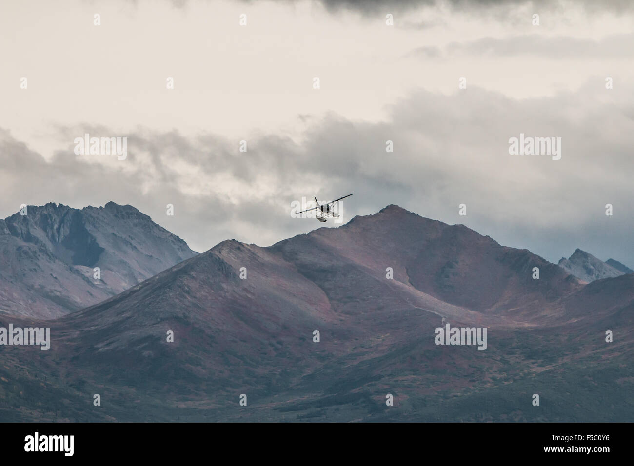 Sea plane over mountains in Anchorage, alaska Stock Photo - Alamy