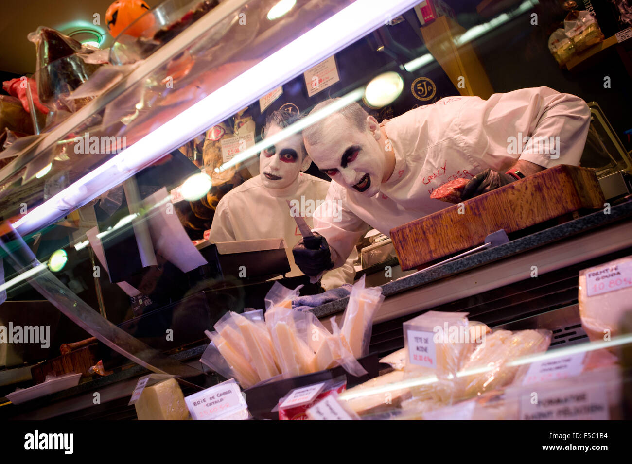 Vendors dressed in their Halloween costumes pose for a photo at Santa ...