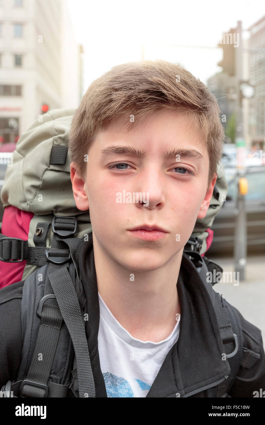 portrait of a teenage boy with heavy backpack Stock Photo - Alamy
