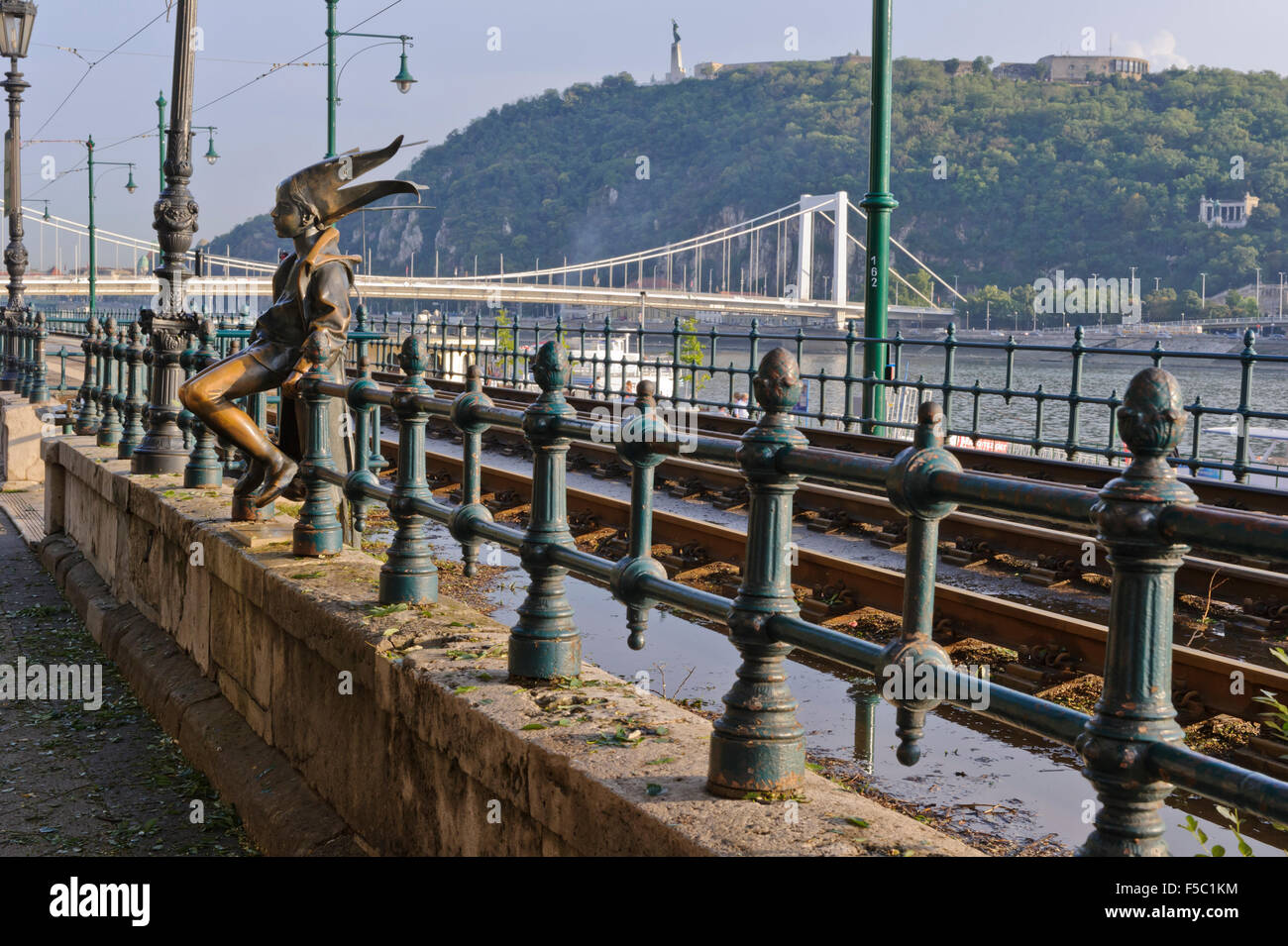 The Little Princess bronze sculpture sitting on the railings by the ...