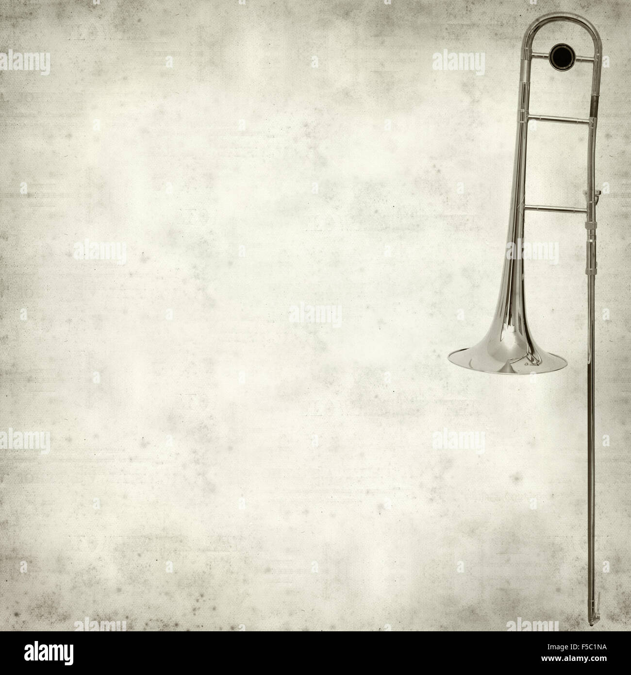 textured old paper background with silver trombone Stock Photo - Alamy
