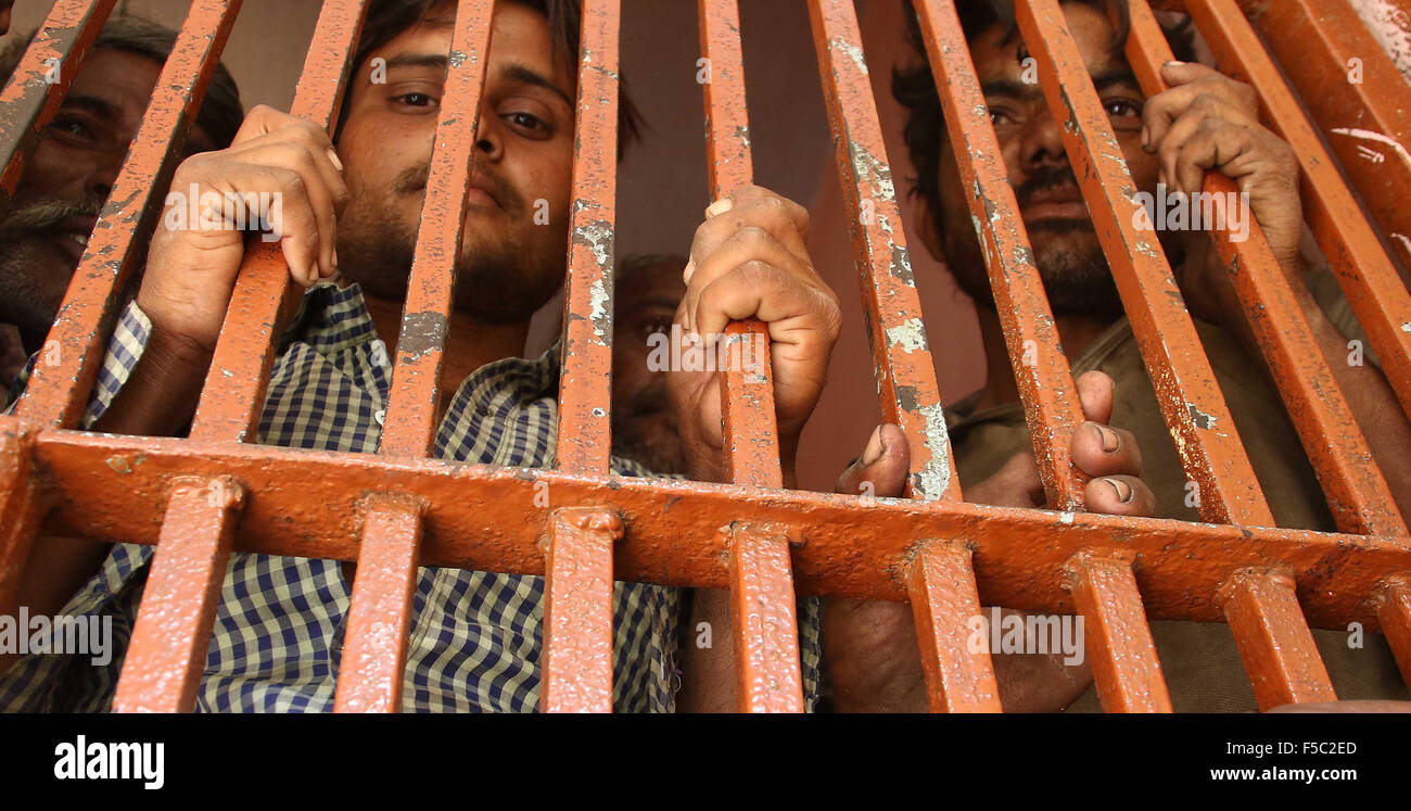 Karachi. 1st Nov, 2015. Arrested Indian fishermen stand inside a police ...