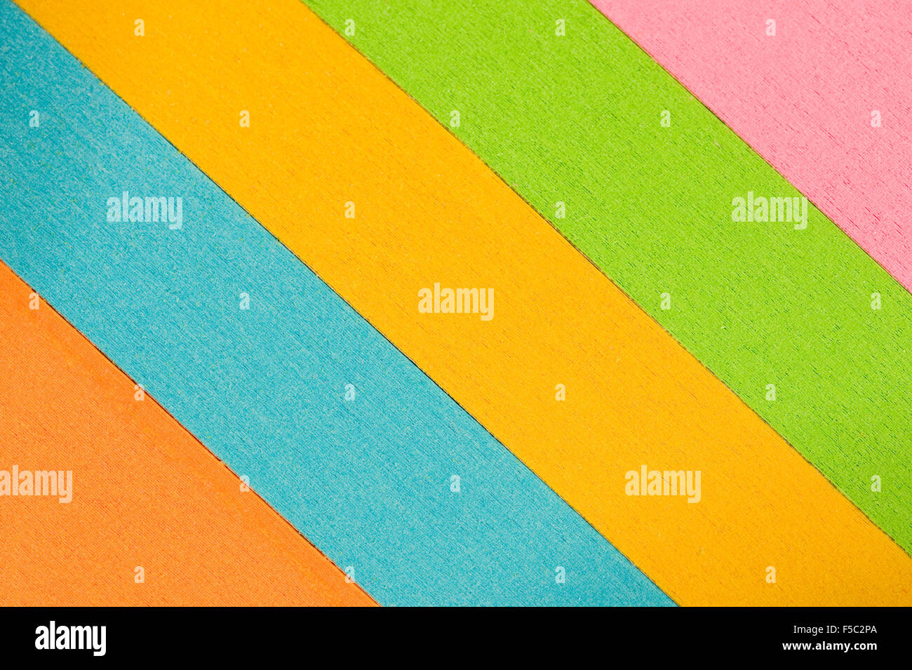 Slanted Multi-colored Stacks of Paper Background Stock Photo - Alamy