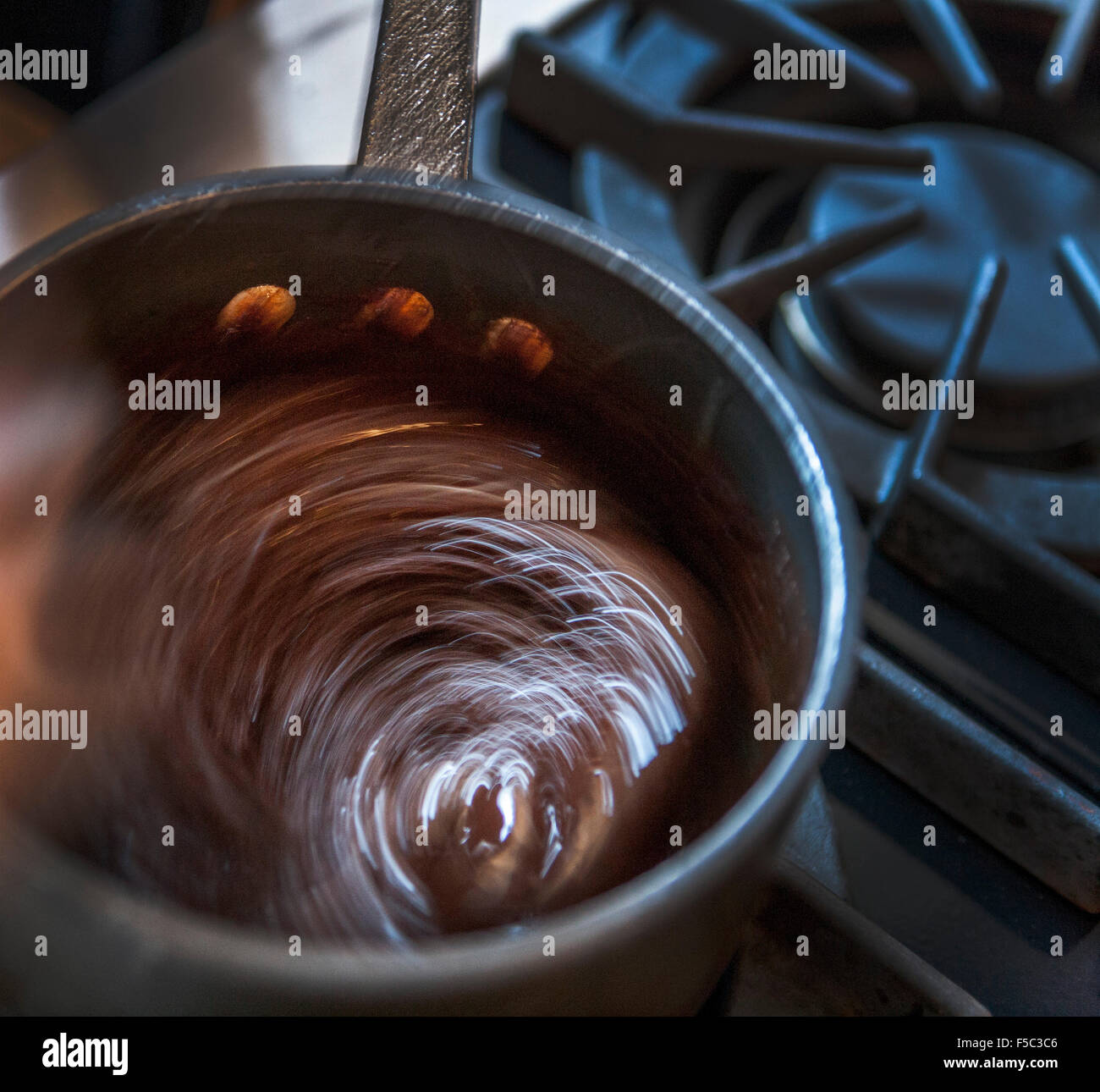 Melting chocolate stove hi-res stock photography and images - Alamy