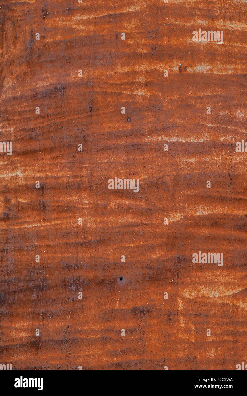 Bright rust stained corroded metal surface with uneven paint Stock ...