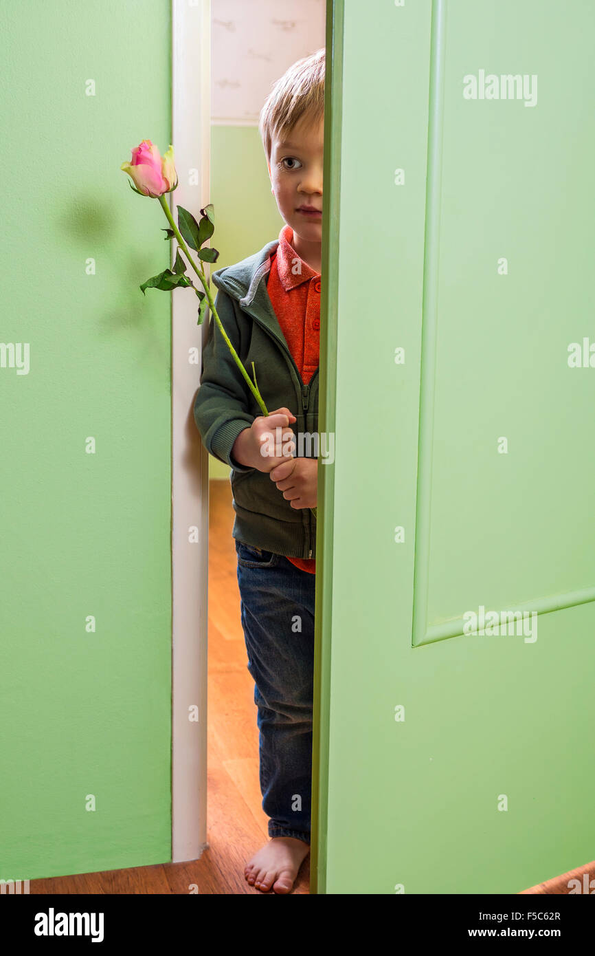 Adorable child holding rose hi-res stock photography and images - Alamy