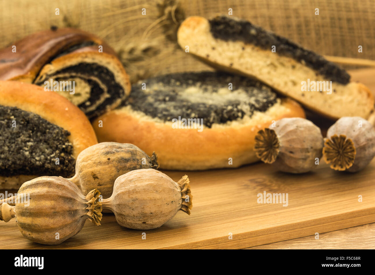 poppys' heads in the foreground and poppys' bakery behind it Stock ...