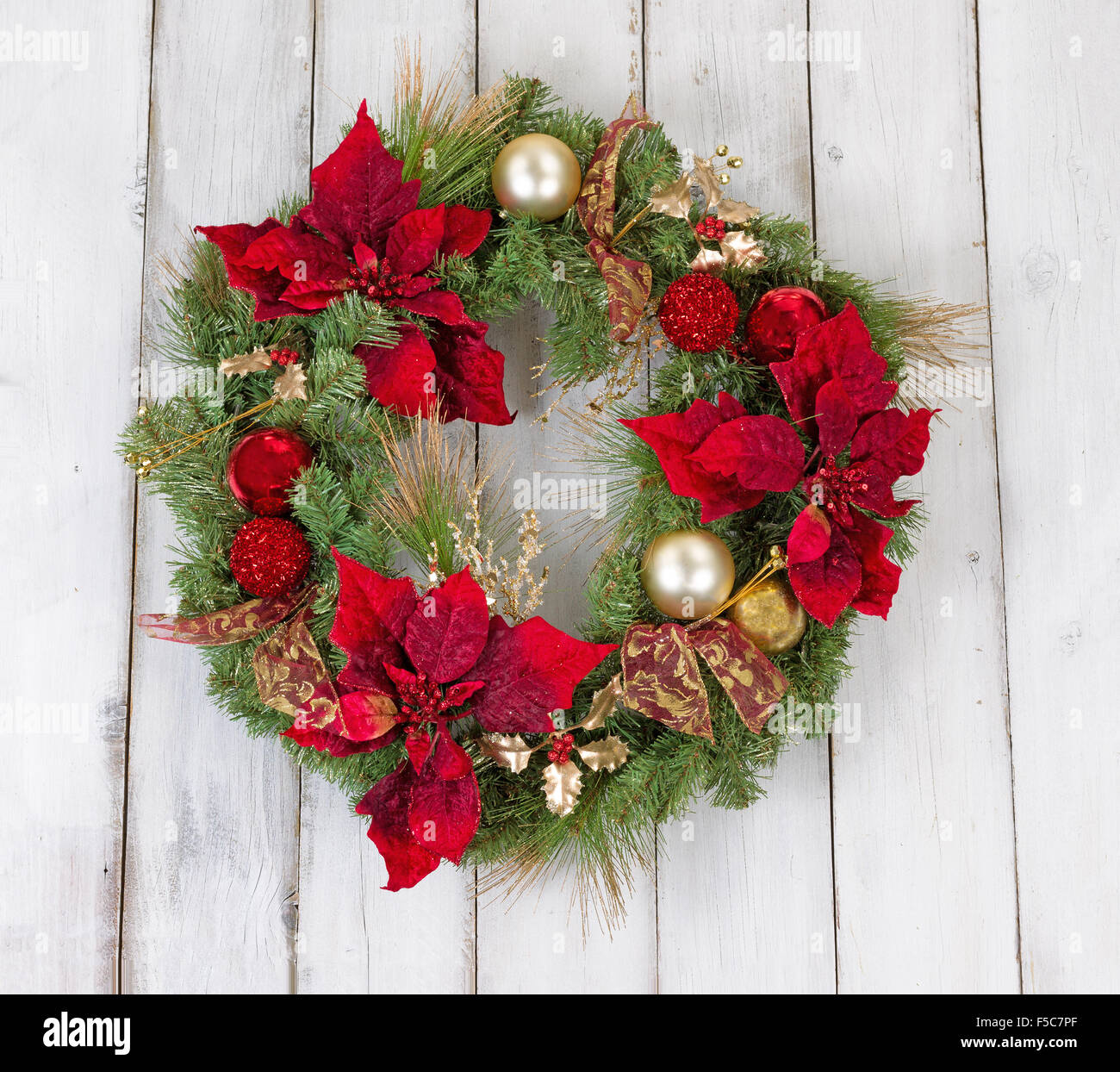 Traditional Christmas wreath on rustic white wood. Boards in vertical ...