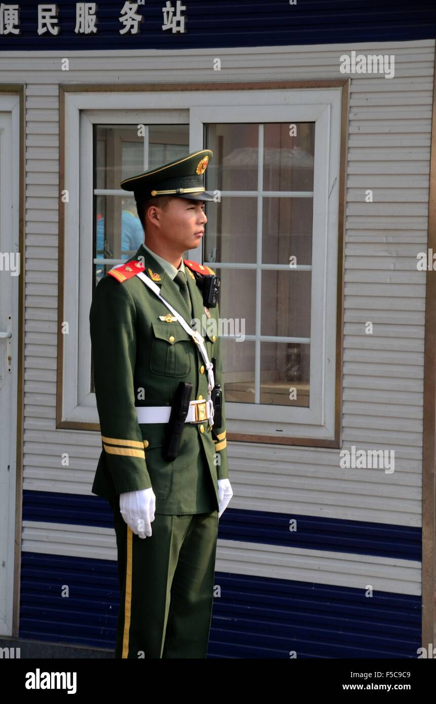 Chinese policeman smartly stands guard in Beijing China Stock Photo - Alamy