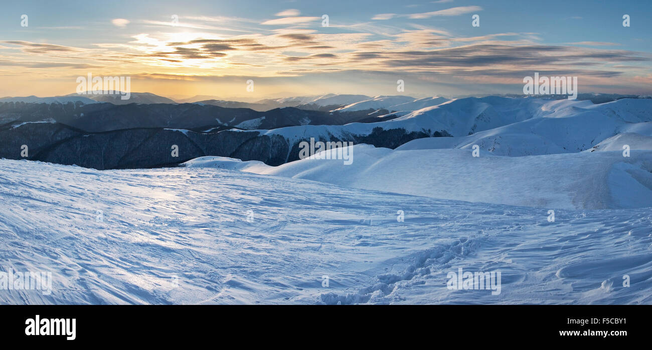 Beautiful mountain sunset landscape with sun way on ice-coated ...