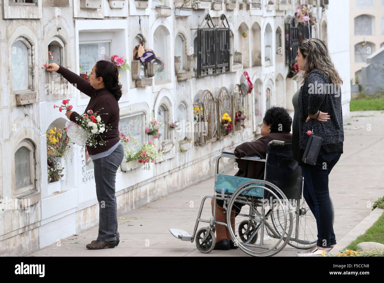 Lima, Peru. 1st Nov, 2015. People visit the El Angel cemetery during ...