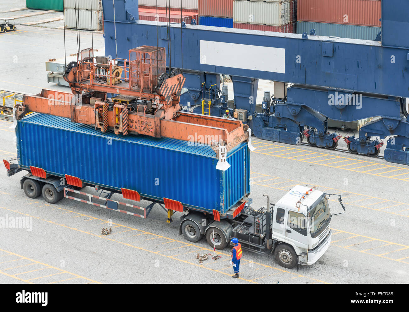 Container Cargo freight ship with working crane loading bridge in ...