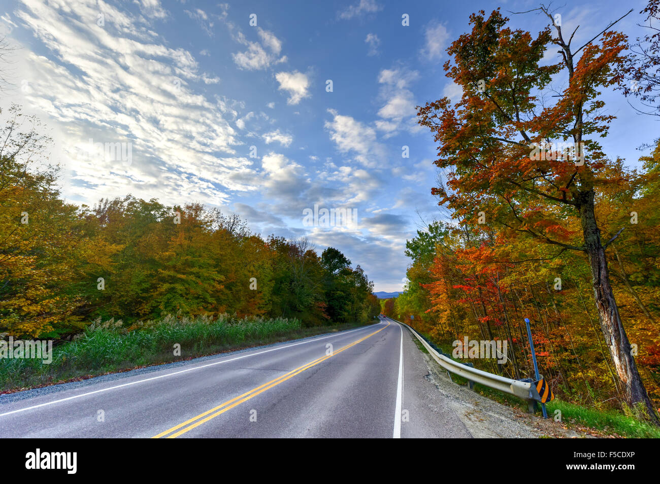 Peak fall foliage along the road through Smugglers Notch, Vermont Stock ...