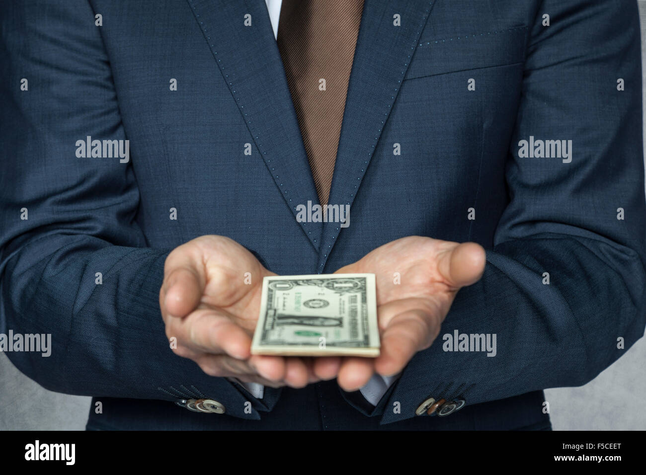 businessman with bribe on his hand Stock Photo - Alamy