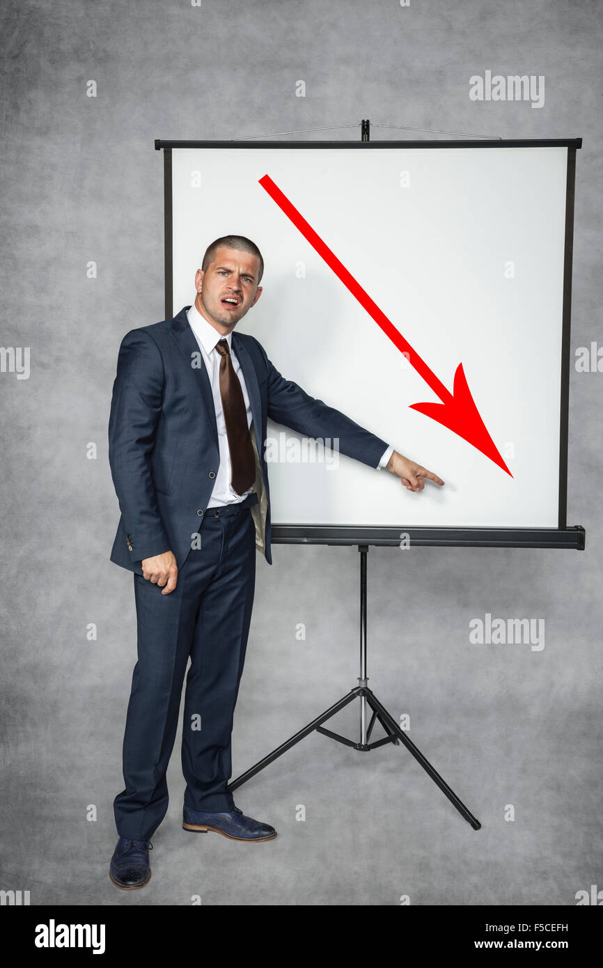 businessman shows decrease Stock Photo - Alamy