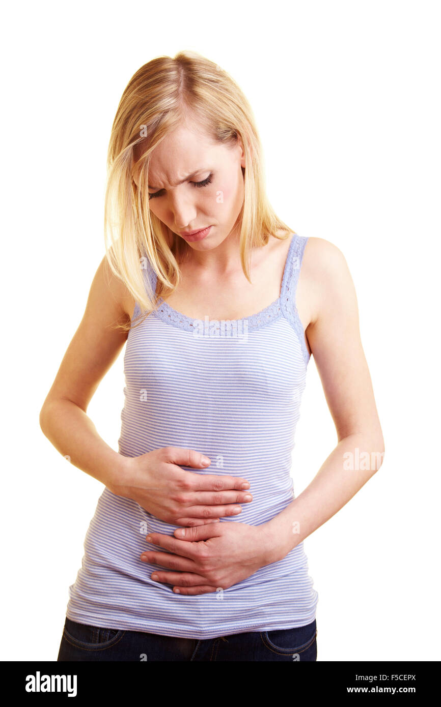 Young blonde woman with stomach ache holding her belly Stock Photo - Alamy
