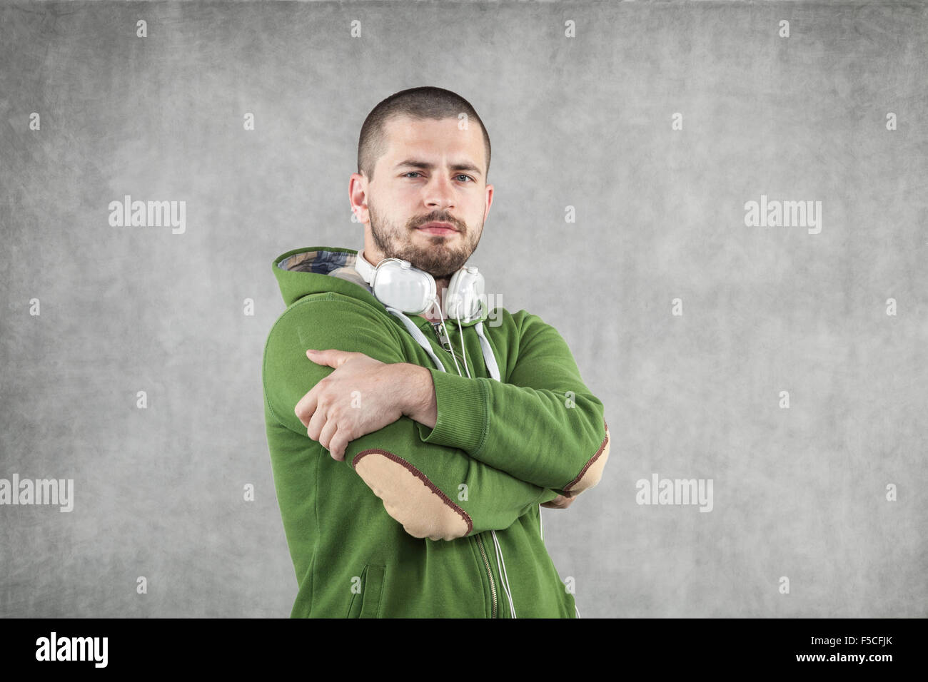 young DJ with headphones on neck Stock Photo - Alamy