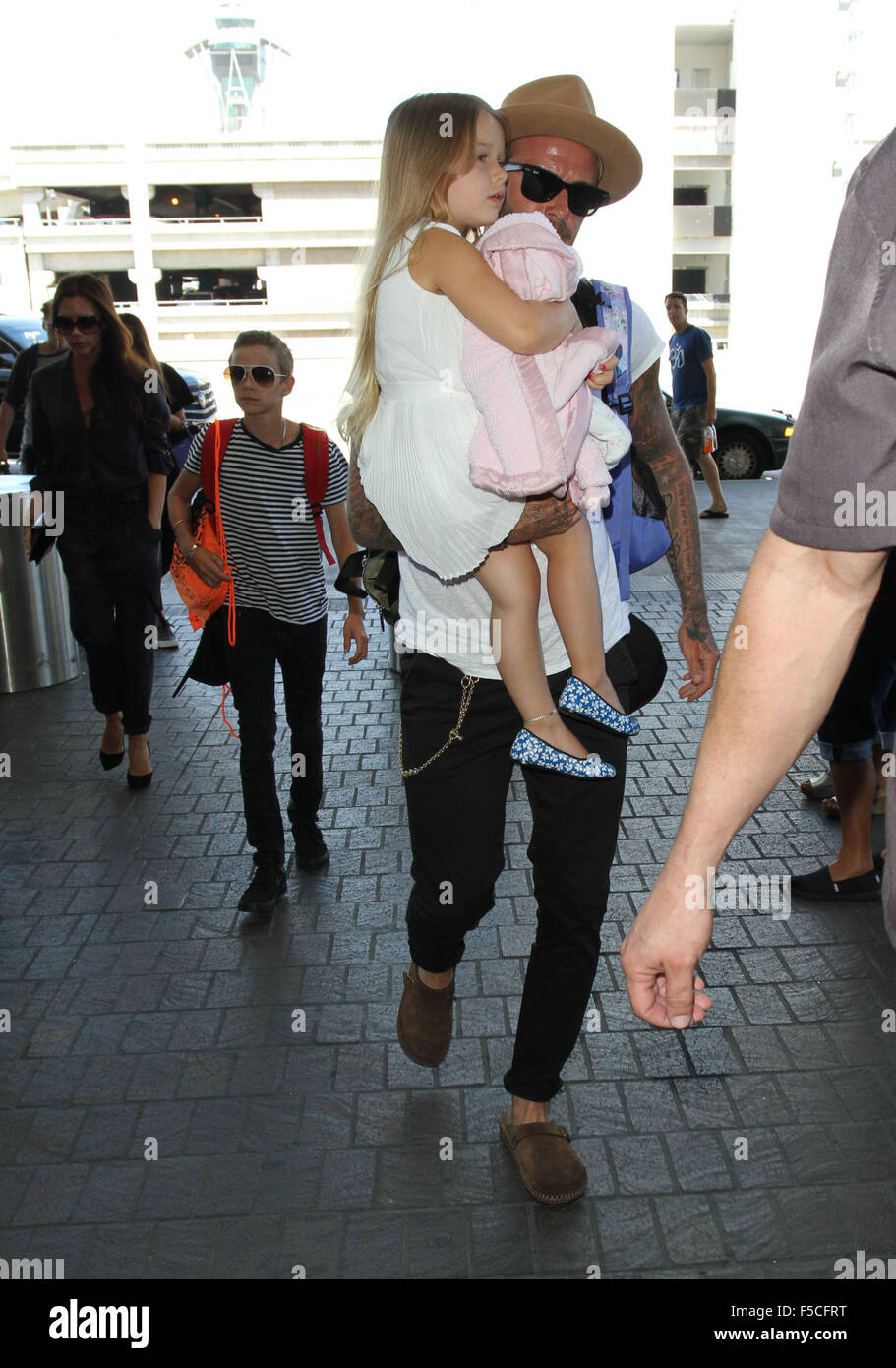 David Beckham, wife Victoria and their four children arrive at Los ...