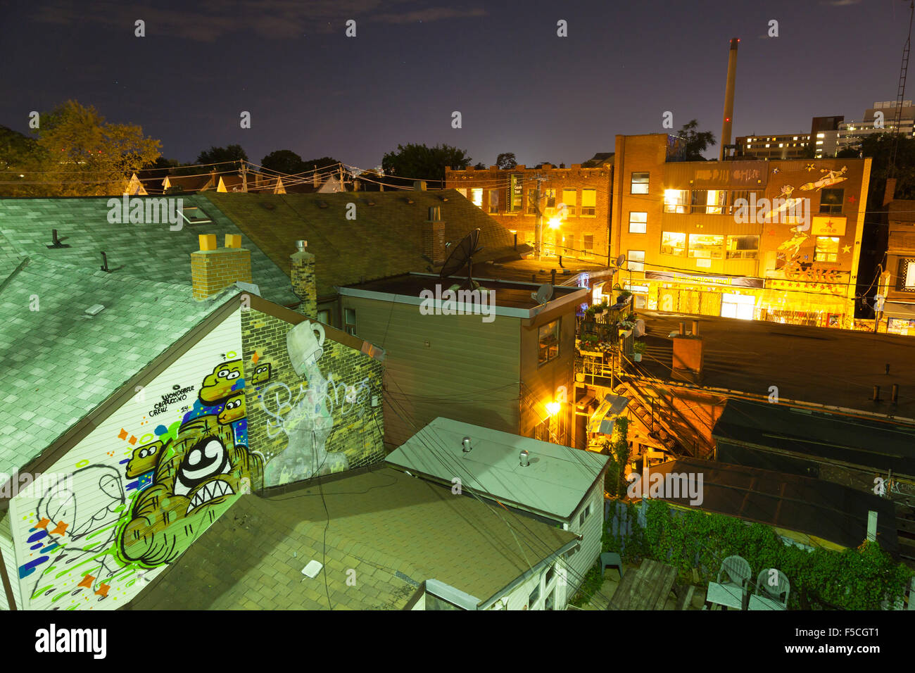 The graffiti covered back alleys of Kensington Market facing Kensington ...