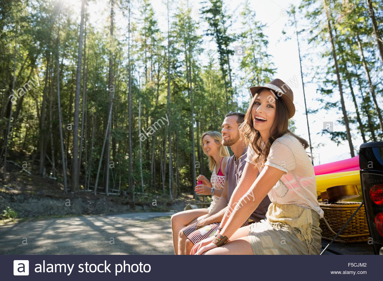 Portrait smiling young woman hanging out with friends Stock Photo - Alamy