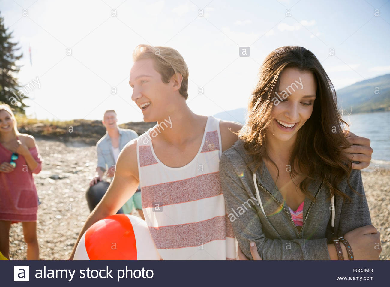 Woman hugging beach ball hi-res stock photography and images - Alamy