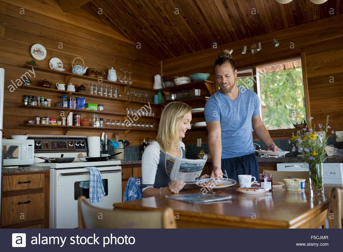 Man and woman serving High Resolution Stock Photography and Images - Alamy