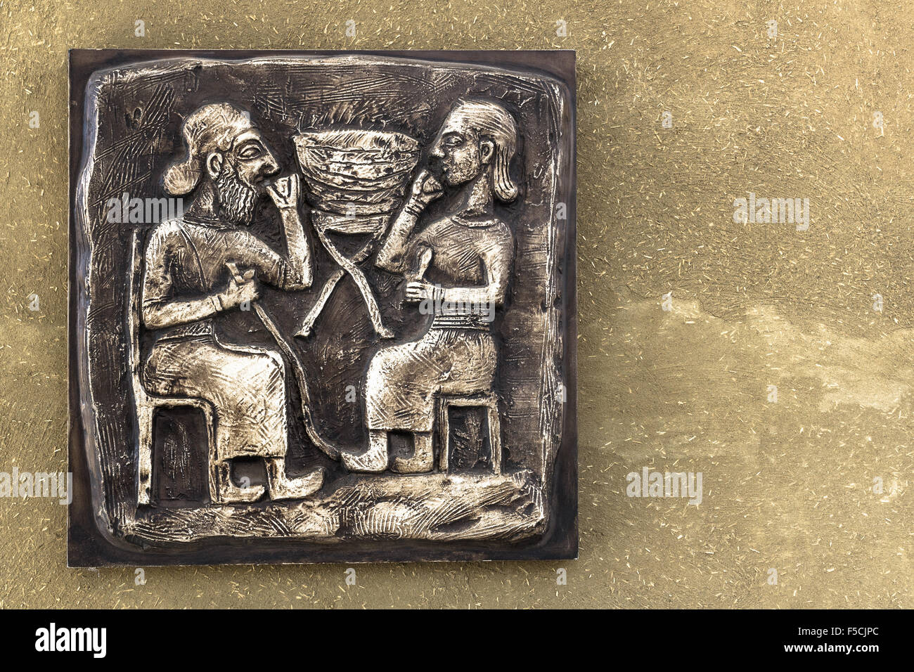 An ancient Mayan relief on bronze tablet with golden tones Stock Photo ...