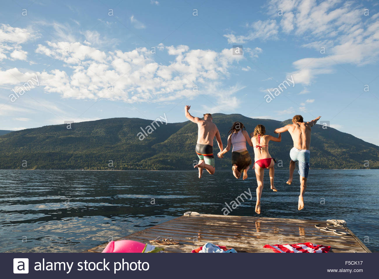 Man jumping from the dock hi-res stock photography and images - Alamy