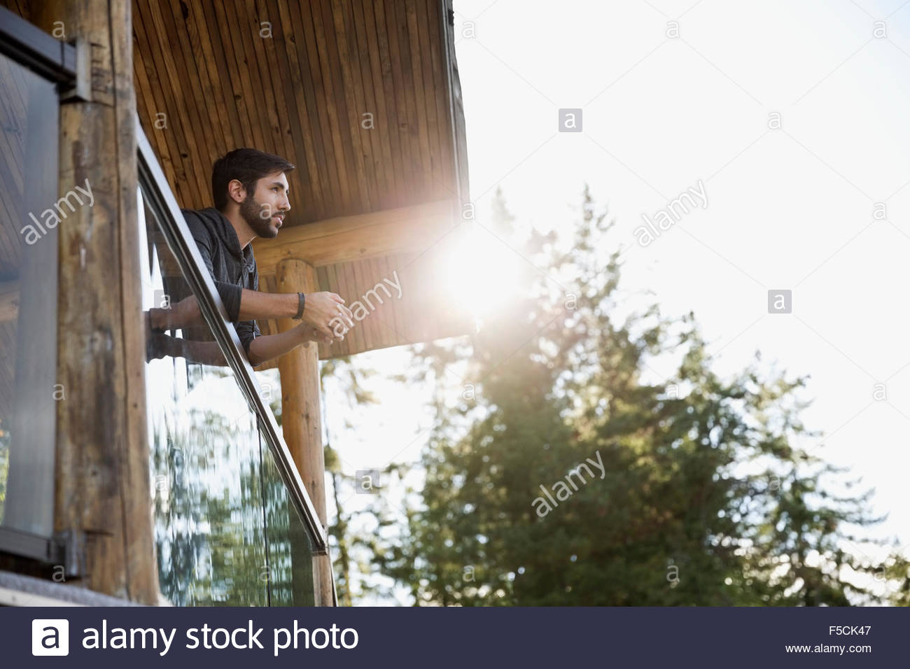 Man standing balcony balcony hi-res stock photography and images - Alamy