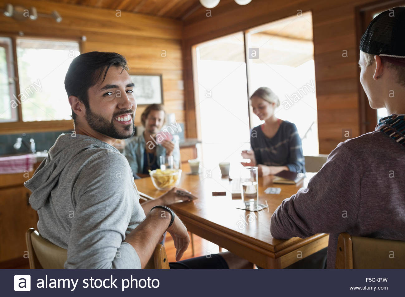 Four Friends Playing Game Cards High Resolution Stock Photography and ...