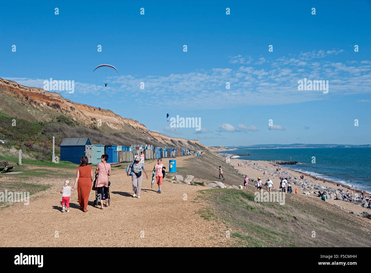 barton on sea beach hampshire with paragliders and beach huts Stock ...