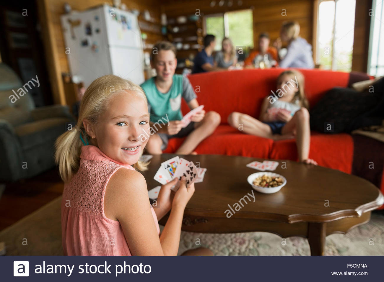 Girl playing cards hi-res stock photography and images - Alamy