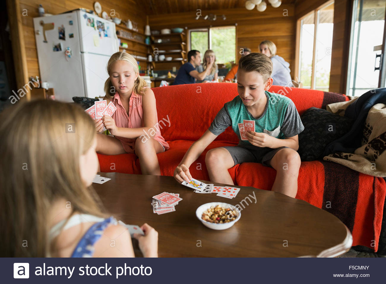 Brother sister playing cards hi-res stock photography and images - Alamy