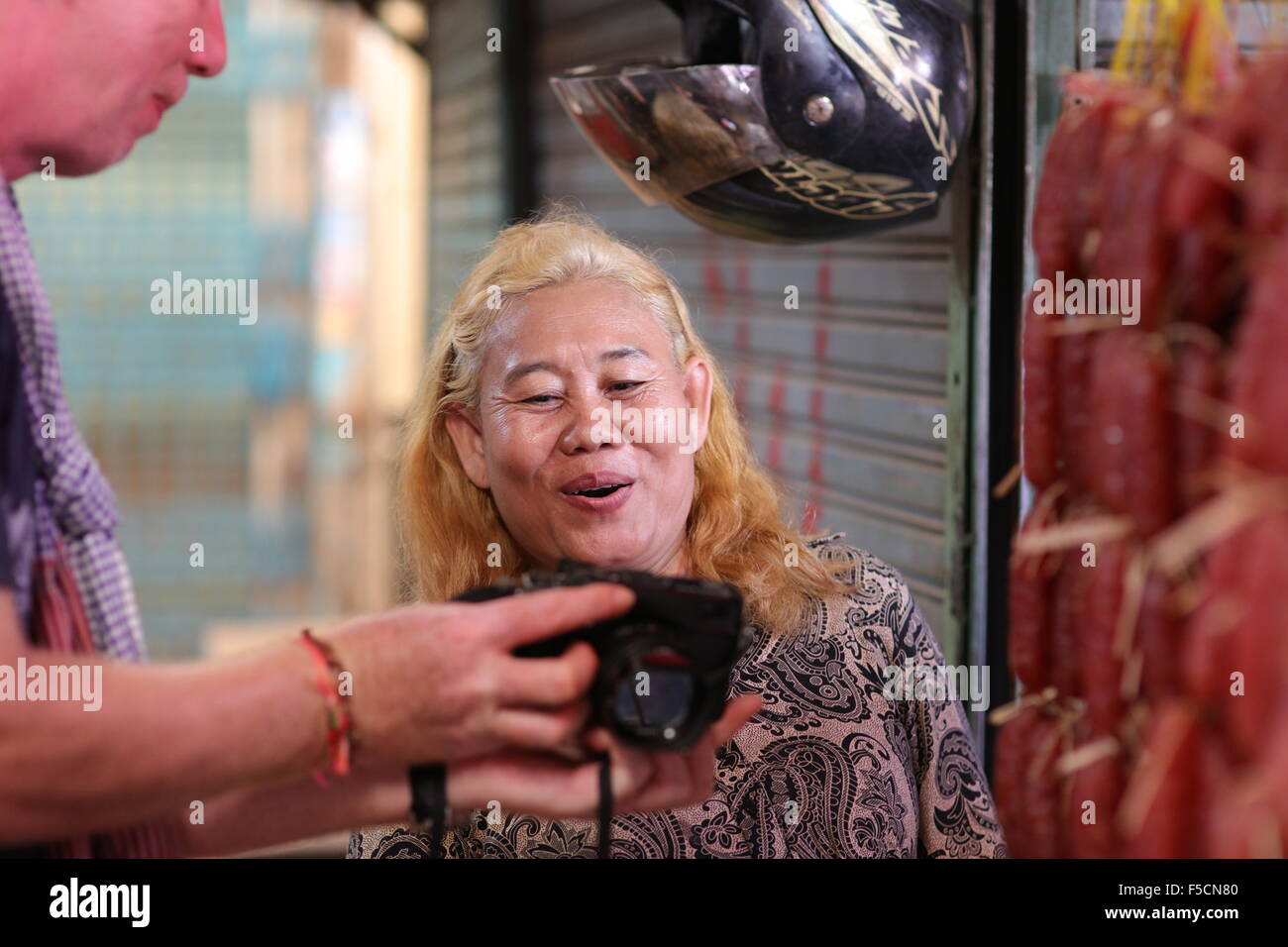 Woman being shown her picture Stock Photo - Alamy