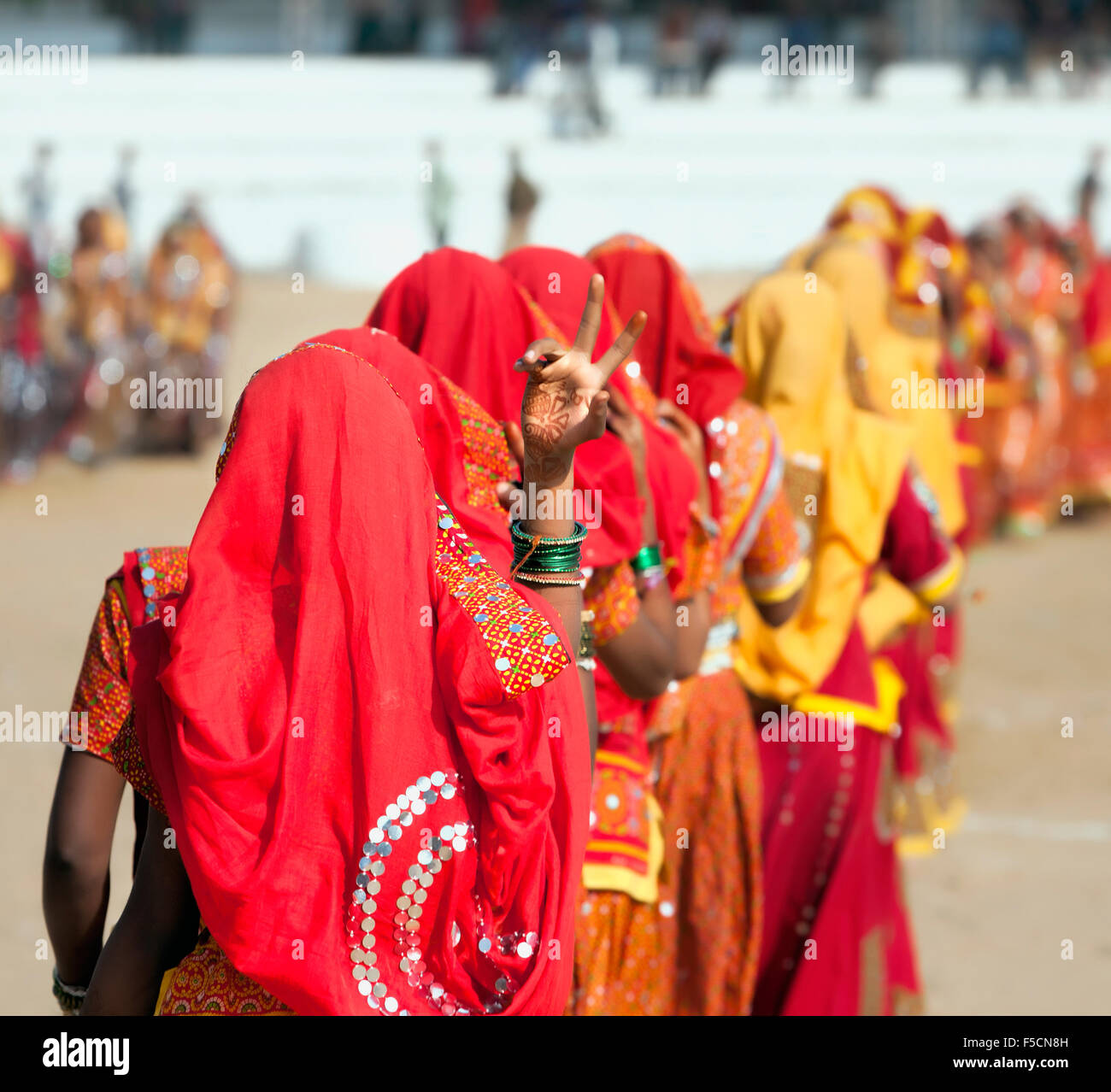 Indian girls in colorful ethnic attire dancing at Pushkar fair, Pushkar ...