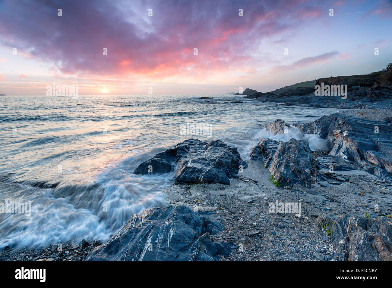 Stunning sunset over the rocky beach at Trevone Bay near Padstow in ...